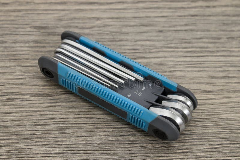 Blue Multitool Allen Keys on a Decorated Wood Table Stock Photo - Image ...