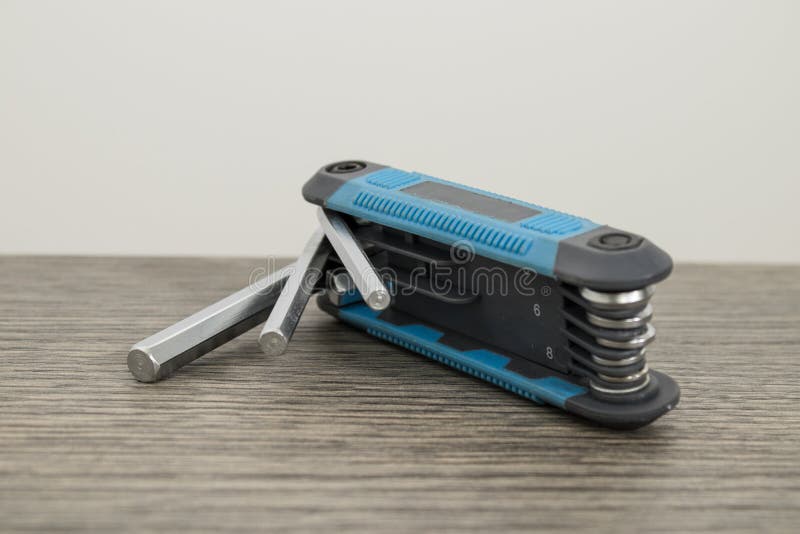 Blue Multitool Allen Keys on a Decorated Wood Table Stock Photo - Image ...