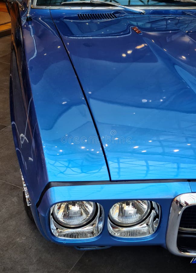 Blue musclecar at expo stock photo. Image of blue, glass - 259946826
