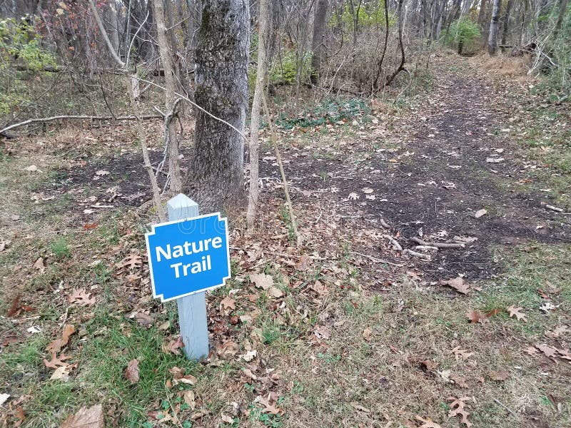Blue Nature Trail Sign with Trail or Path and Trees Stock Image - Image ...
