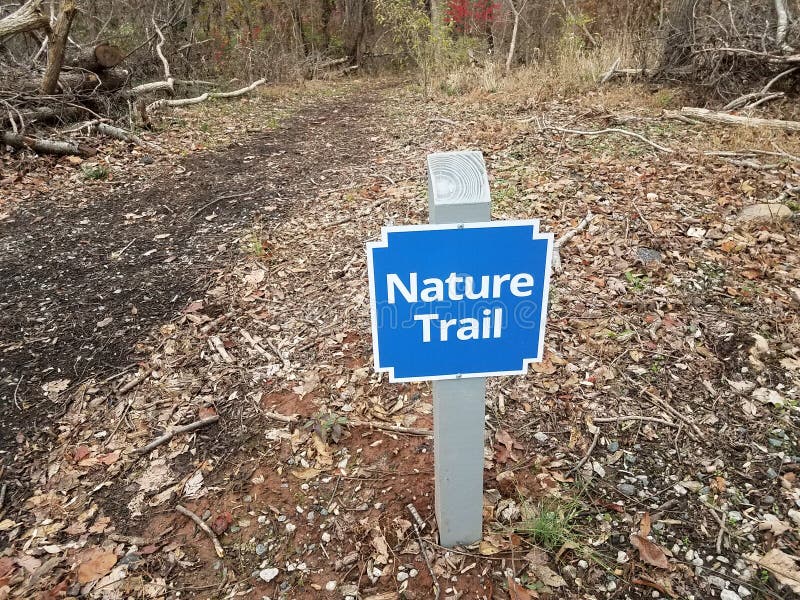 Blue Nature Trail Sign with Trail or Path and Trees Stock Image - Image ...