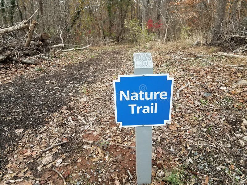 Blue Nature Trail Sign with Trail or Path and Trees Stock Image - Image ...