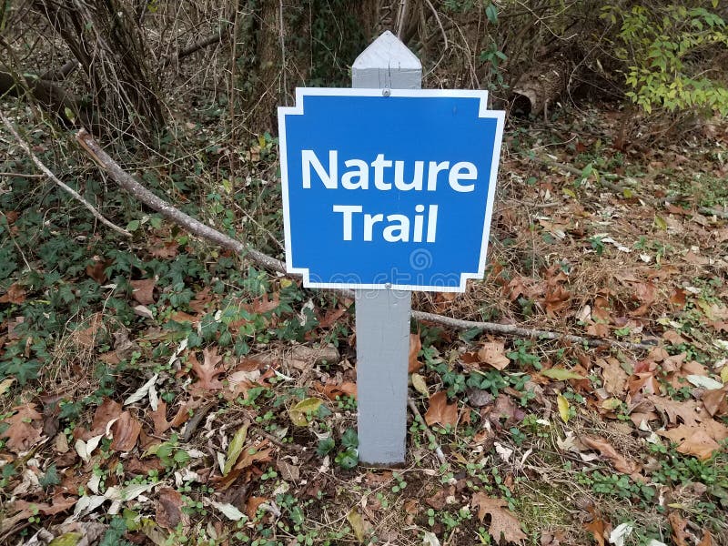Blue Nature Trail Sign with Trail or Path and Trees Stock Image - Image ...