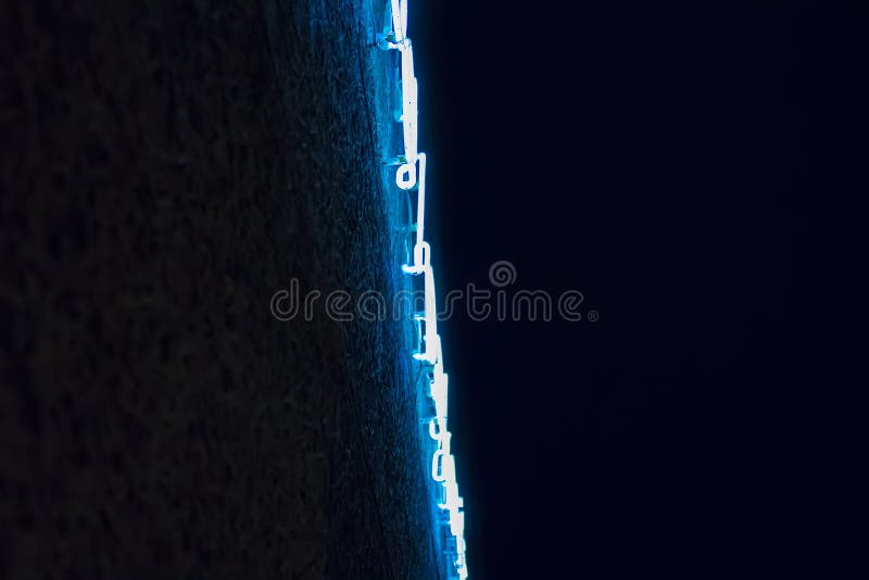 Blue Neon Light on Dark Texture Wall from Bottom Stock Photo - Image of ...