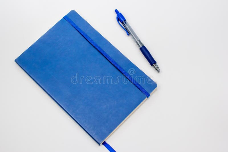 Blue Notebook and Pen on White Background. Top View. Copy Space. Stock ...