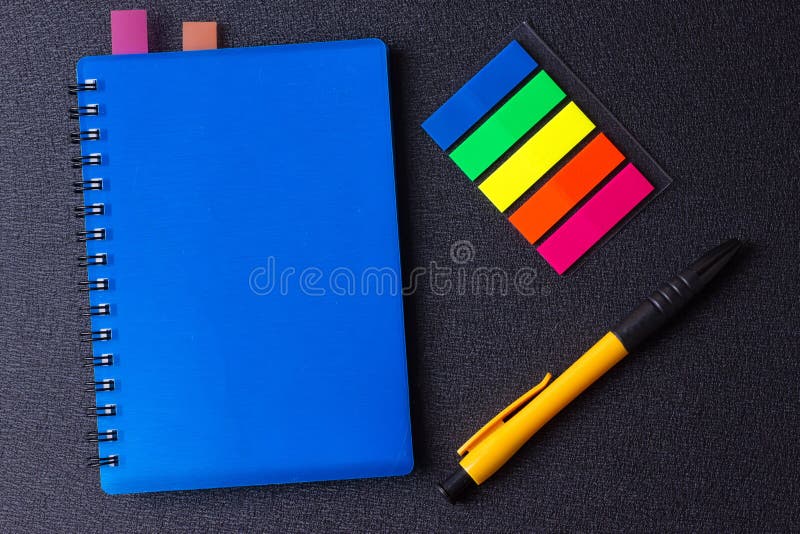 Blue Notepad with Multi-colored Stickers and Pen Stock Photo - Image of ...