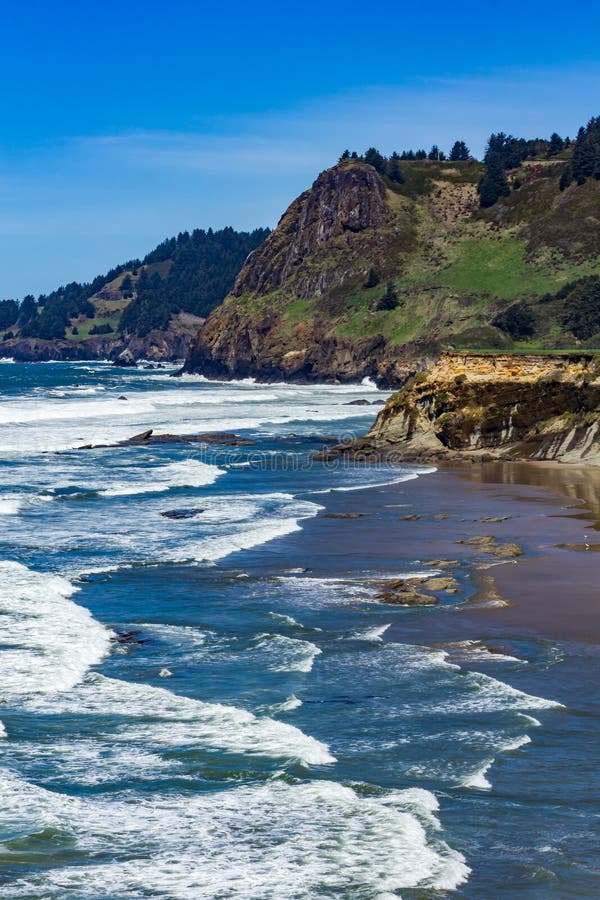 Ocean Shore with Cliffs in Background Stock Image - Image of scenic ...