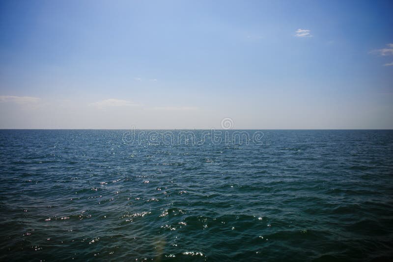 The Blue Ocean with Dull Clouds on a Lovely Sunny Day Stock Photo ...