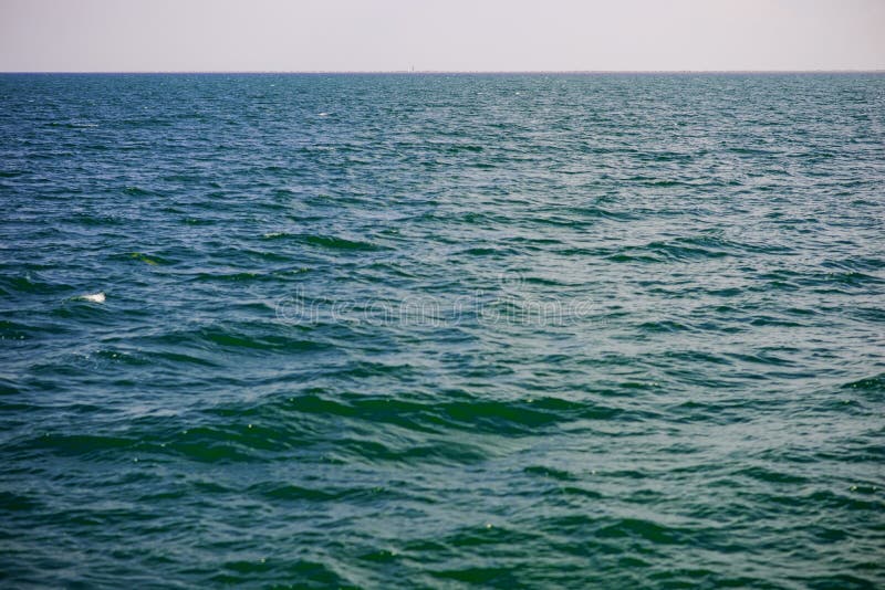 The Blue Ocean with Dull Clouds on a Lovely Sunny Day Stock Photo ...