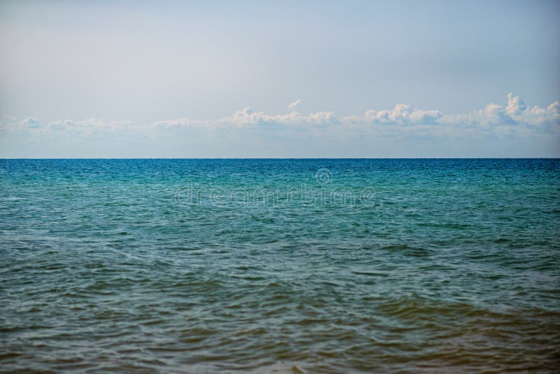 The Blue Ocean with Dull Clouds on a Lovely Sunny Day Stock Image ...