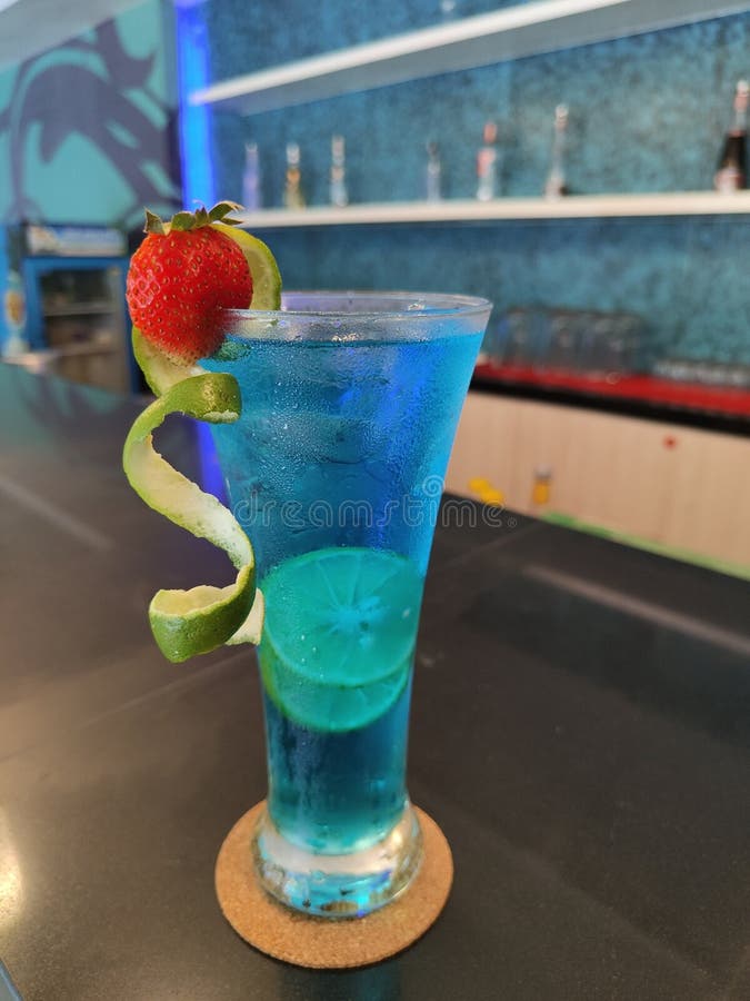 Blue Ocean Mocktail with Lime and Strawberry Stock Image - Image of ...