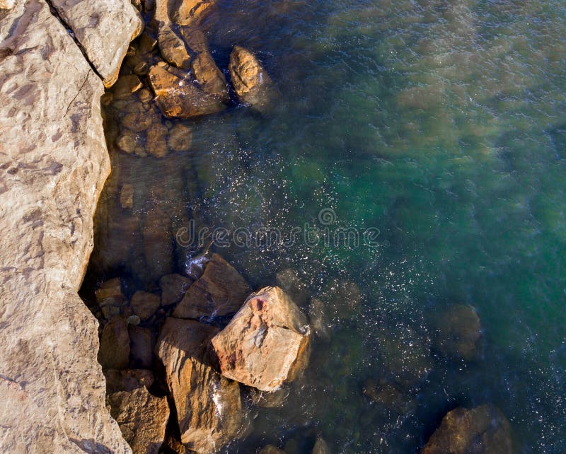 Blue ocean with rocks stock photo. Image of autumn, wall - 186195644