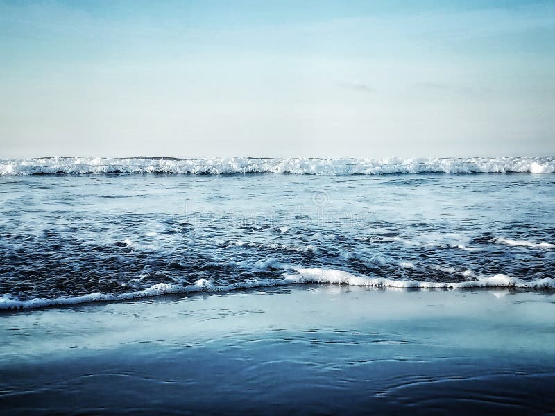 Blue ocean waves stock photo. Image of reflection, beach - 192556098