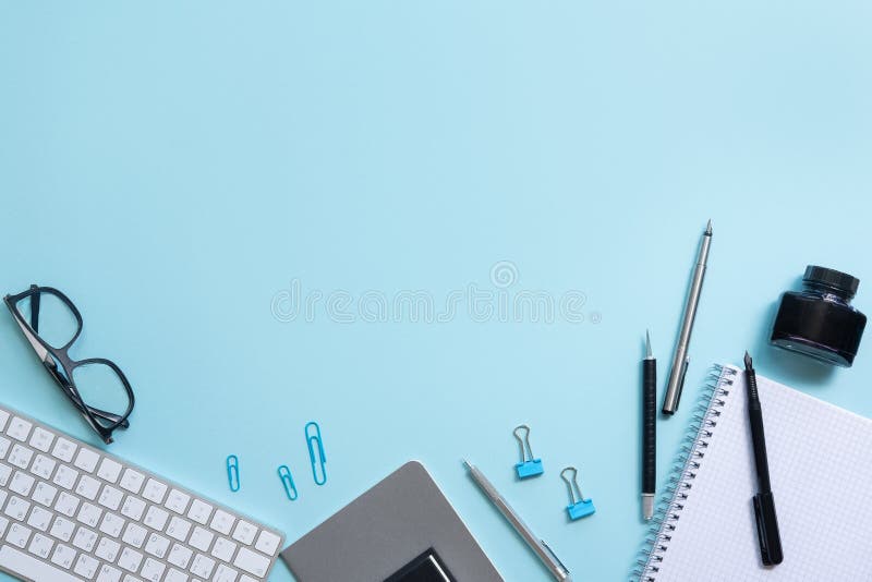 Blue Office Desk Table with Blank Notebook, Computer Keyboard and Other ...