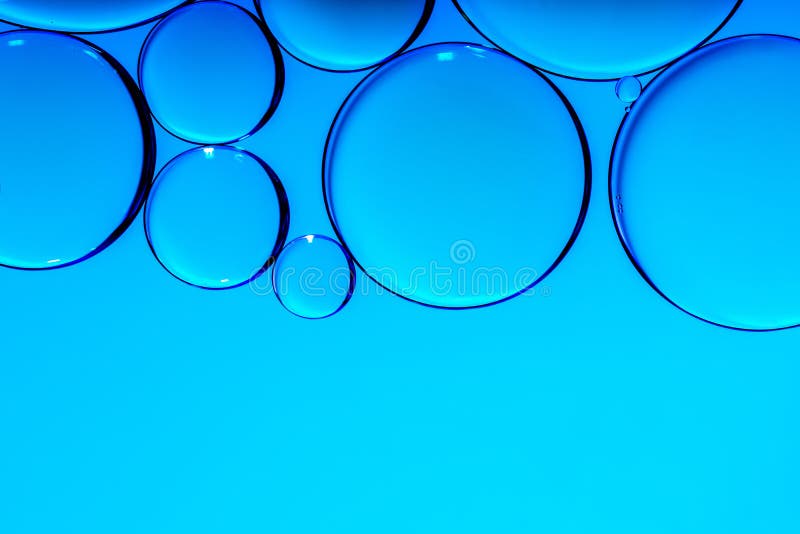 Blue Oil Drops in Water. Bubbles of Different Sizes Stock Image - Image ...