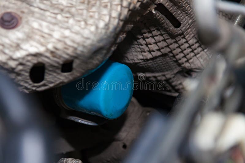 Blue Oil Filter for a Car Engine in the Engine Compartment of a Car ...