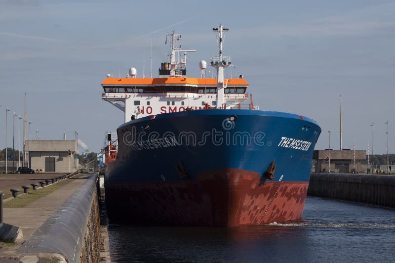 Blue and orange ship editorial photo. Image of port, water - 34752681