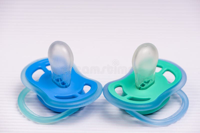 Blue Pacifier on White Background. Pacifiers Colored Pacifiers Stock ...