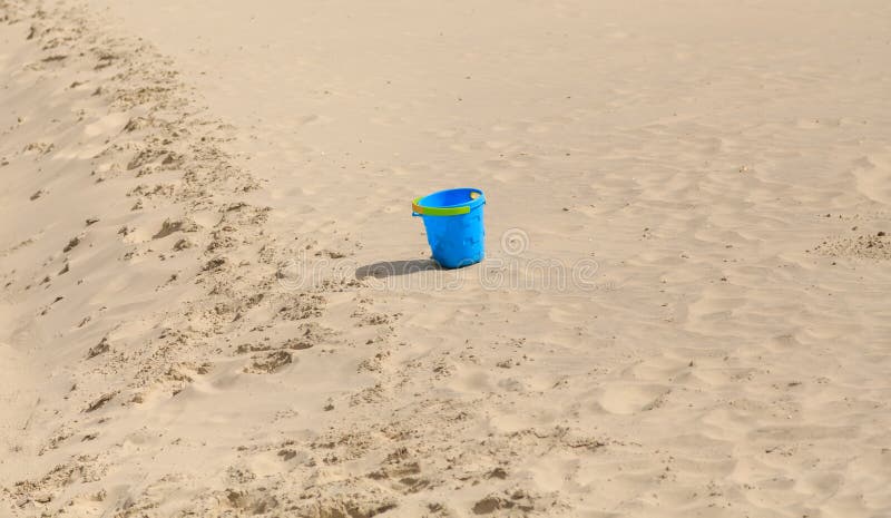 Blue Pail in Sand stock image. Image of childhood, play - 146505163