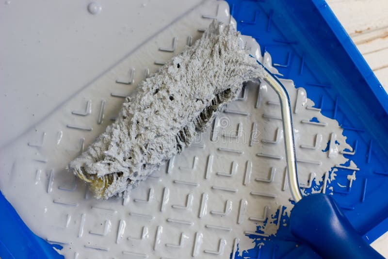 Blue Paint Tray with Paint Roller and Paint Inside it. Stock Image ...