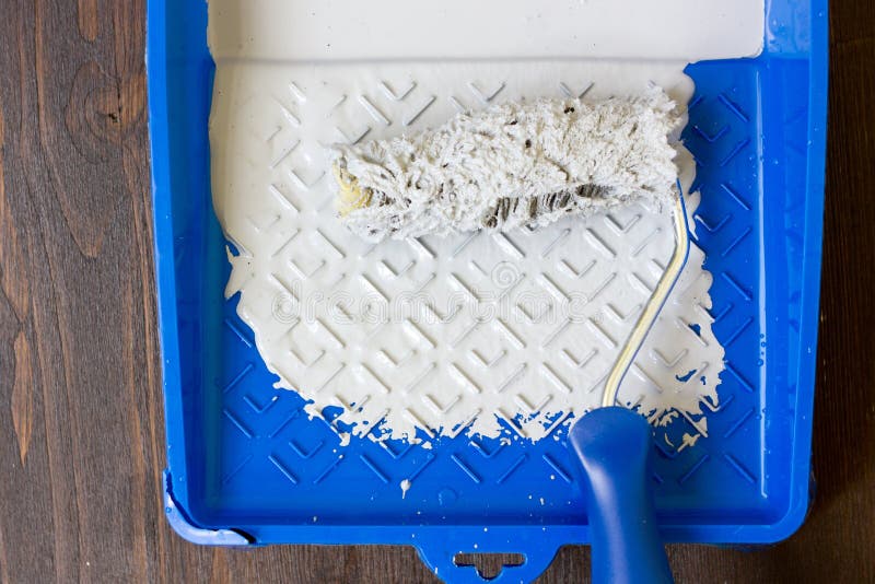 Blue Paint Tray with Paint Roller and Paint Inside it. Stock Image ...