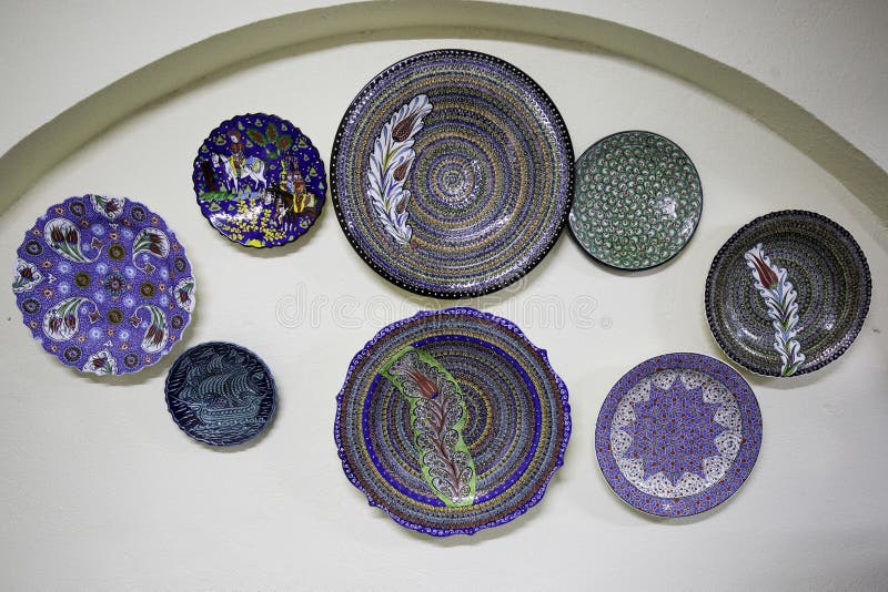 Blue Painted Ceramic Plates Hanging from Wall Editorial Image - Image ...