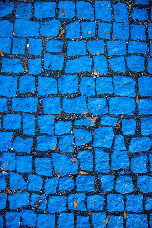 Blue painted cobblestones stock photo. Image of blue - 129140918