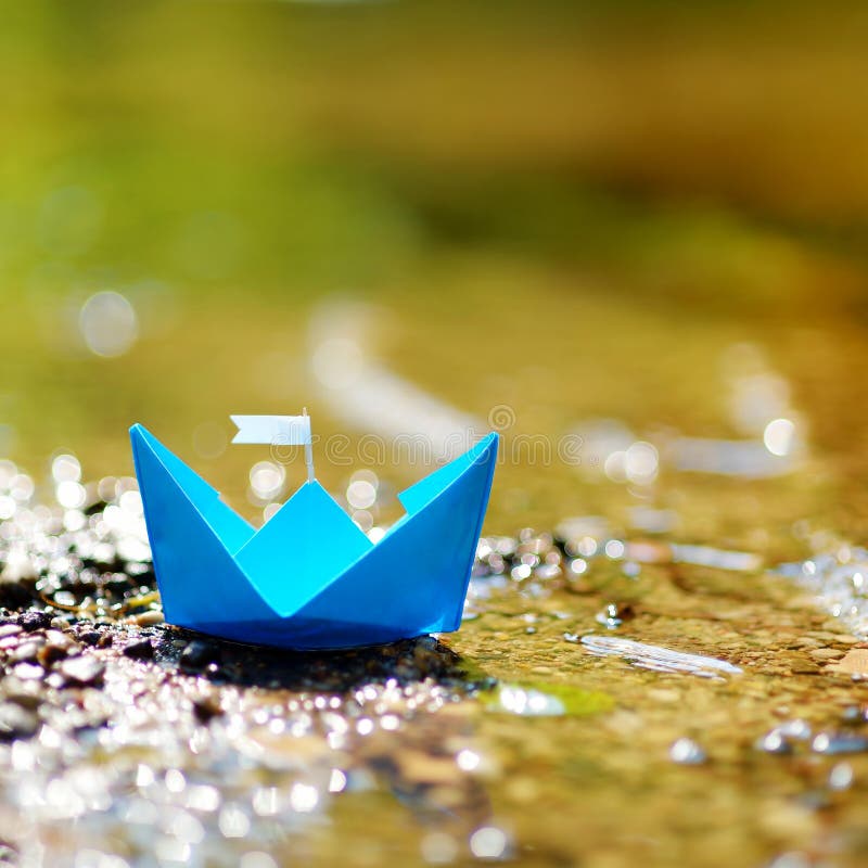 Blue Paper Boat with a White Flag Stock Photo - Image of activity ...