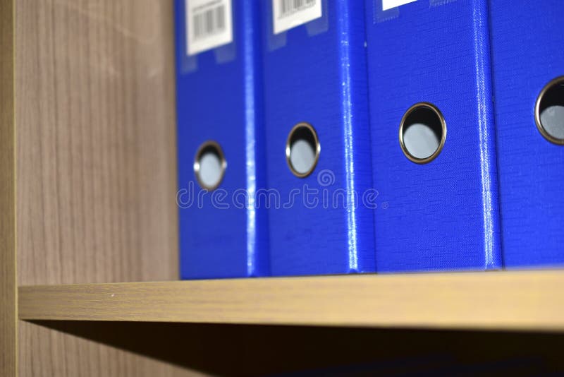 Office Red Folders on the Shelf in the Office Stock Photo - Image of ...
