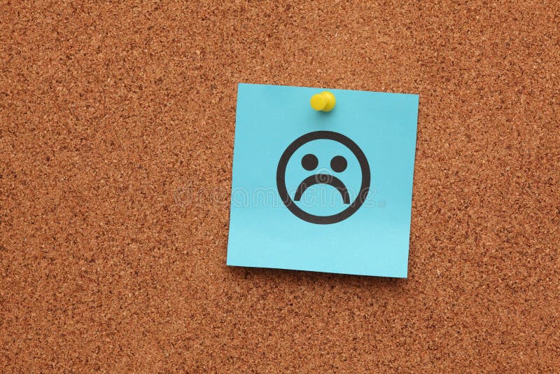 Blue Paper with Sad Face on Corkboard Stock Photo - Image of close ...