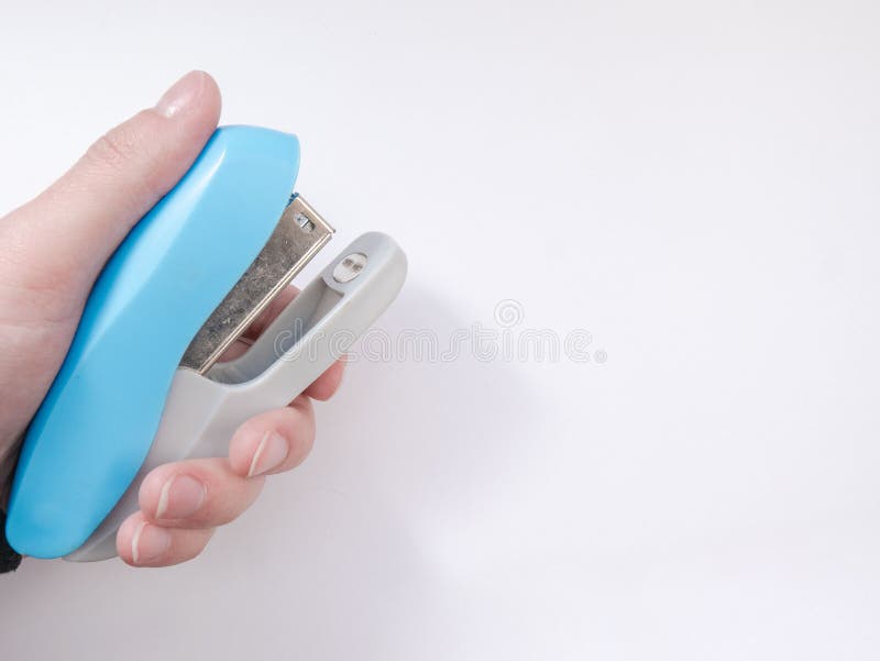 A Blue Paper Stapler is Held in Your Hand. Blue Stapler of the Paper ...