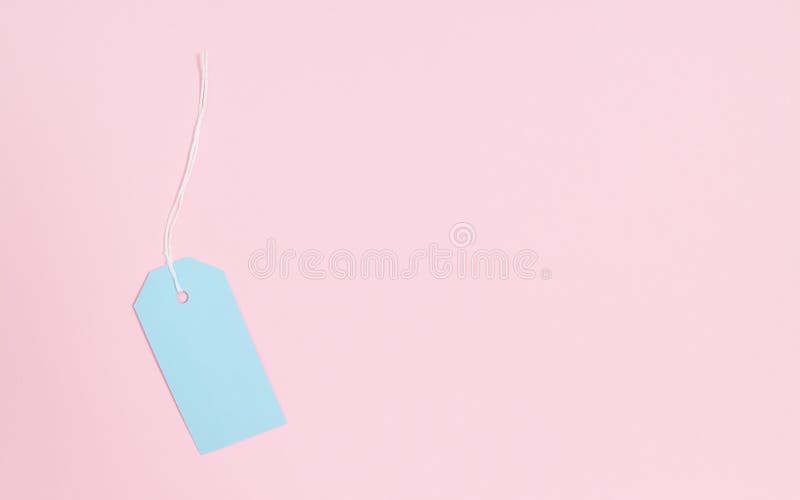 Blue Paper Tag for Notes on a Pink Background. View from Above. Stock ...