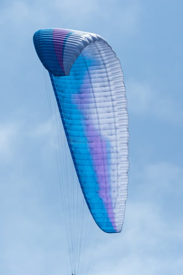 Blue parachute in blue sky stock photo. Image of adrenaline - 95959804