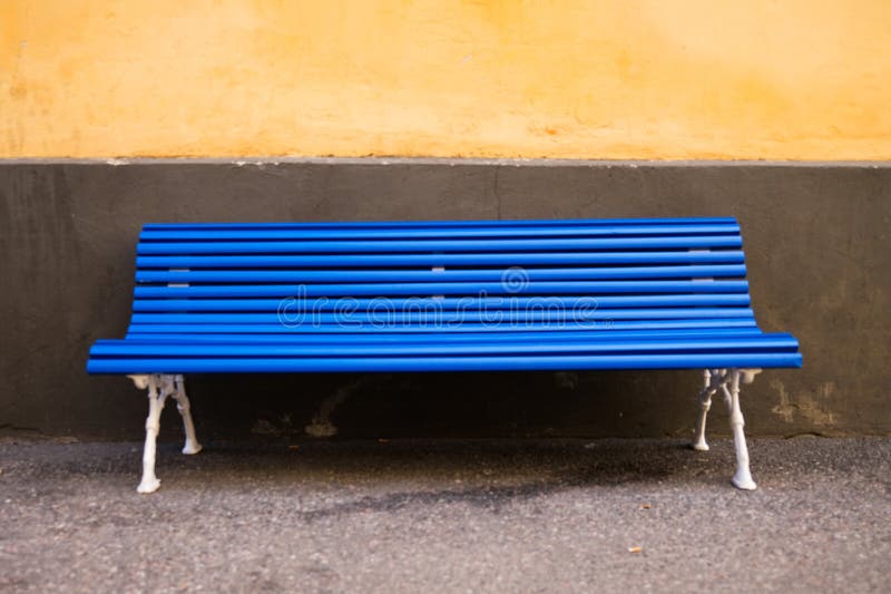 Blue park bench stock image. Image of building, wall - 372216501
