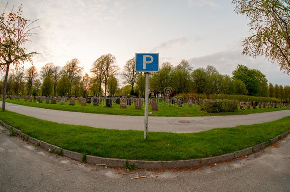 Blue Parking Sign Facing Twilight Cemetery.. Stock Photo - Image of ...
