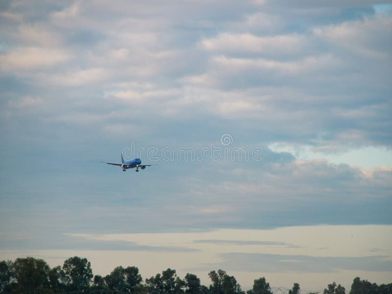 Blue Passenger Plane in the Sky, Landing Stock Photo - Image of flight ...