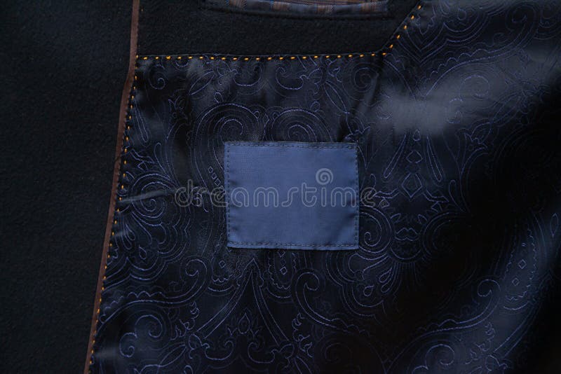 Blue Patch on Patterned Lining Inside Coat Stock Photo - Image of ...