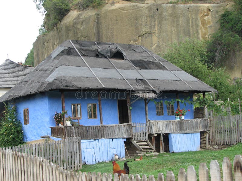 A Blue House at the Base of a Cliff Stock Image - Image of base, cliff ...