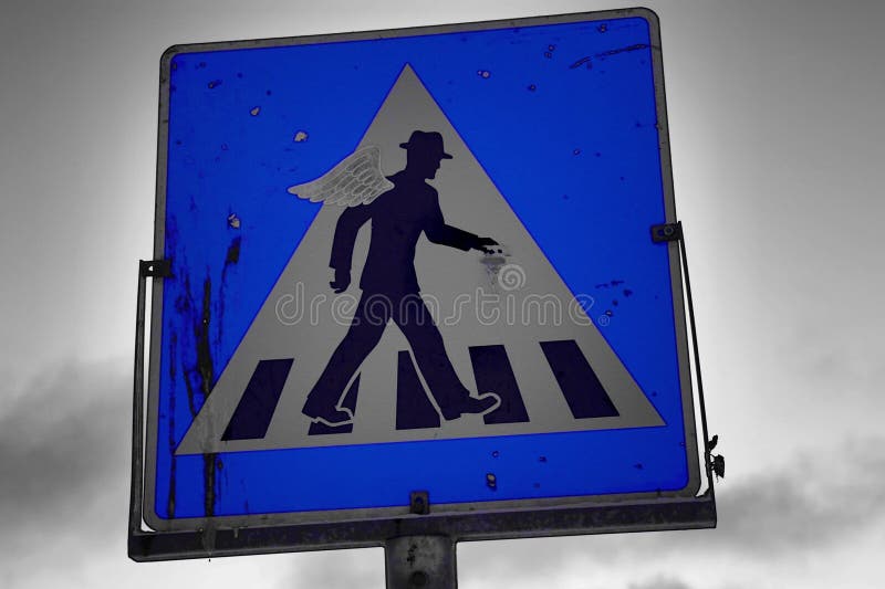 Blue Pedestrian Sign with Angel Wings Sticker on it Stock Photo - Image ...