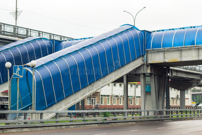 Blue Pedestrian Tunnel Bridge Over a Highway with Multiple Exits in the ...
