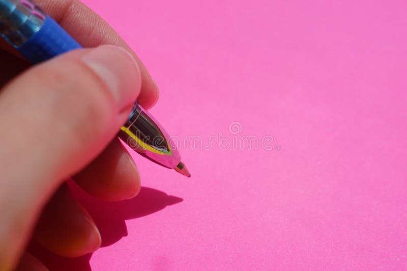 Blue Pen in Female Fingers on Pink Paper Stock Image - Image of closeup ...