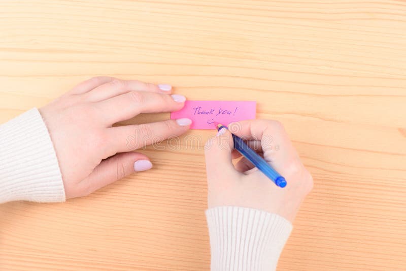 A Blue Pen in the Hands of a Young Woman Writes a Note Thank You. Stock ...