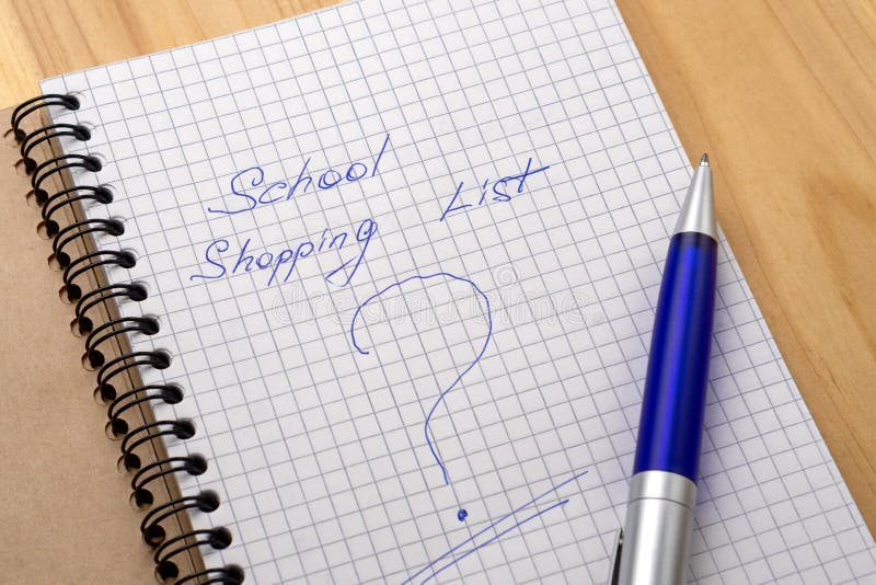 Blue Pen on a Notebook with Sheets in a Cage. Sign Shopping List and ...
