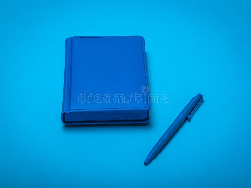 Blue Pen and Blue Notepad on a Blue Background Stock Image - Image of ...