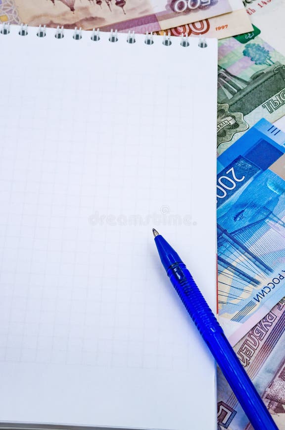 Blue Pen and Notepad. Russian Money and a Notebook for Notes. Paper ...