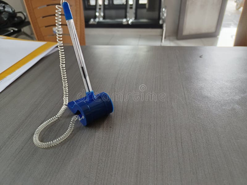 A Blue Pen on the Office Desk Stock Image - Image of tile, floor: 358079581