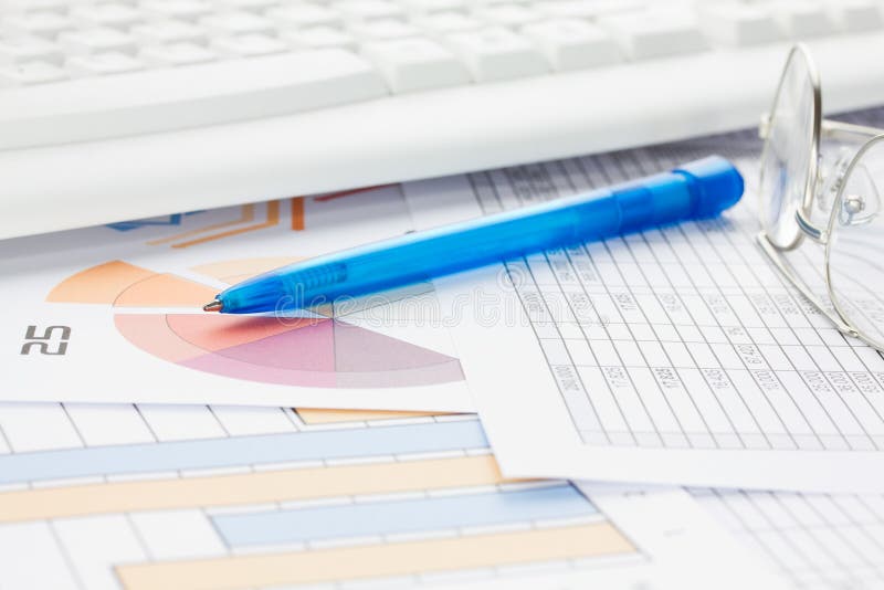 Blue Pen with Spectacles Keyboard and Graphs Stock Photo - Image of ...