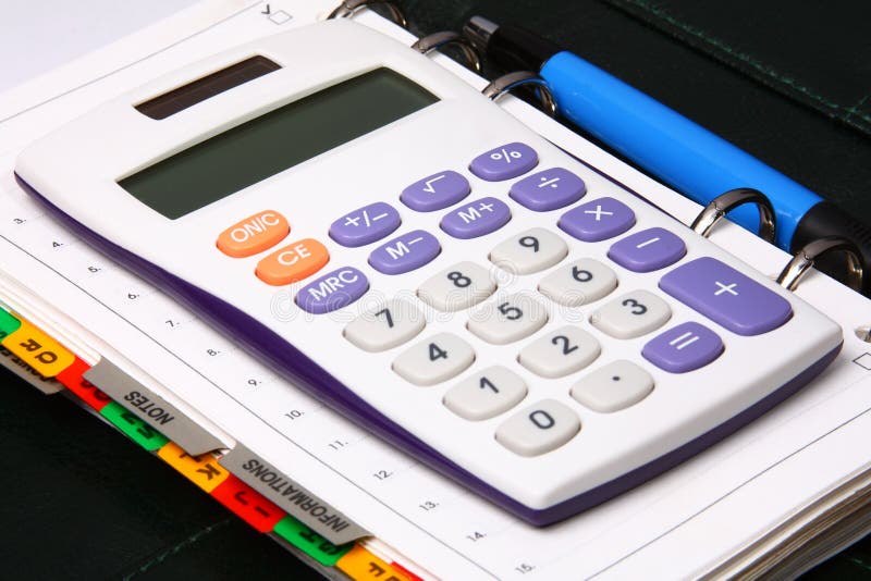 Blue Pen, White Calculator on a Green Organizer Stock Image - Image of ...