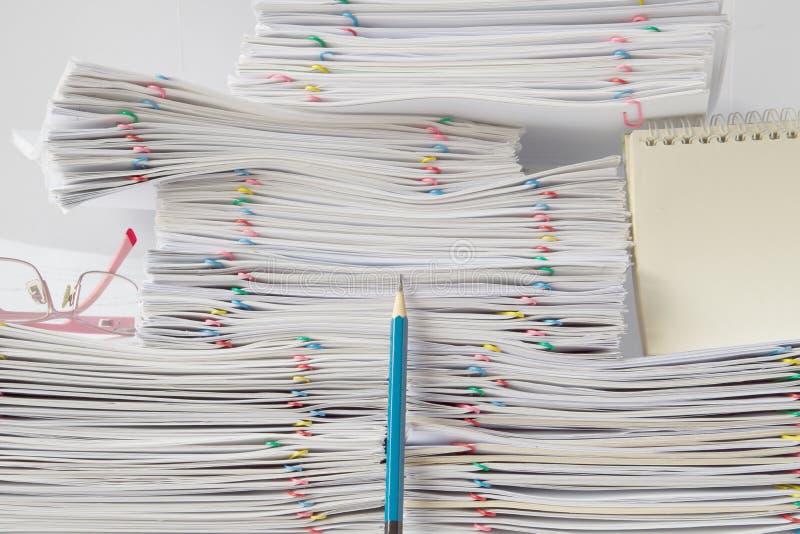 Blue Pencil in Front of Pile of Overload Paperwork Stock Image - Image ...