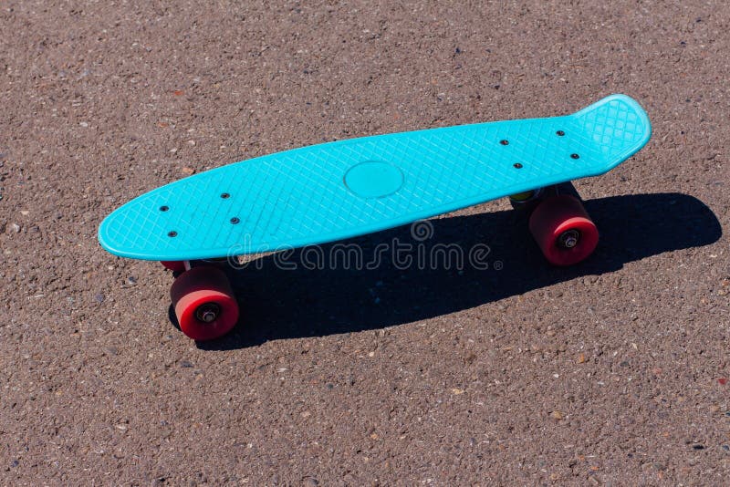 Blue Penny Board with Pink Wheels on the Road Stock Image - Image of ...